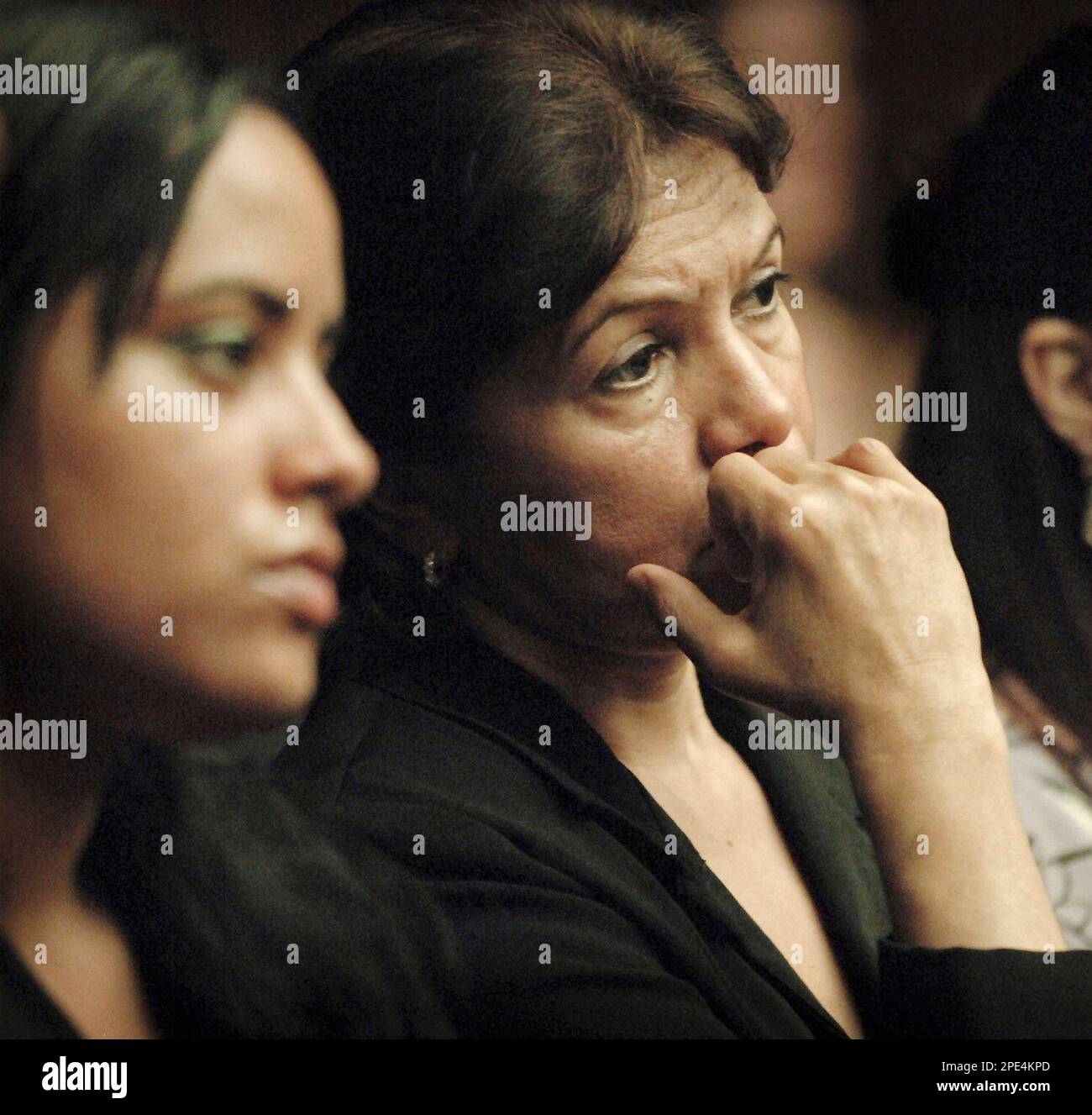 Ada Colono, right, mother of murder victim Michael Colono, listens to ...