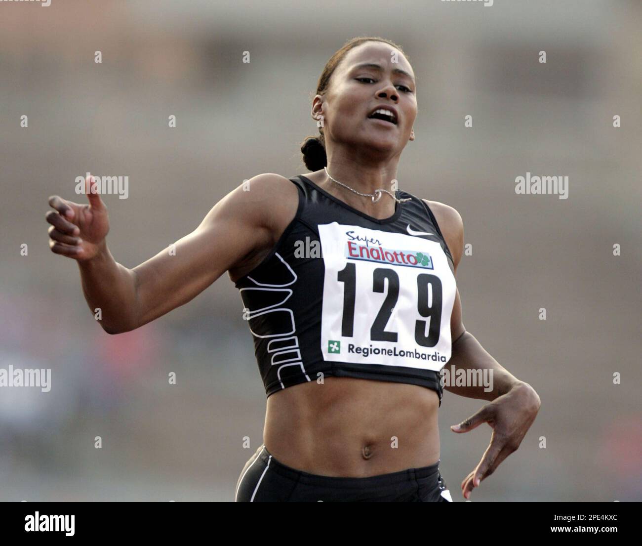U.S. sprinter Marion Jones crosses the finish line as she competes in ...