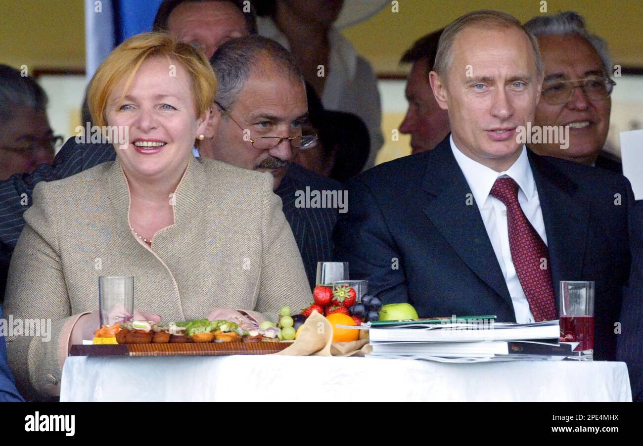 President Vladimir Putin and his wife Lyudmila watch during horse races ...