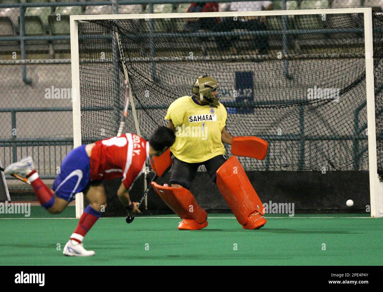 South Korea's Seong Jung Kang, strikes the second goal while India's ...
