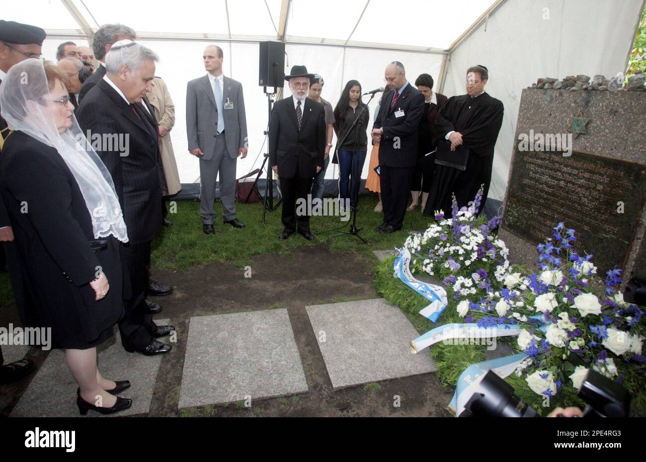 Israeli President Moshe Katsav, 2nd left, prays with his wife Gila ...