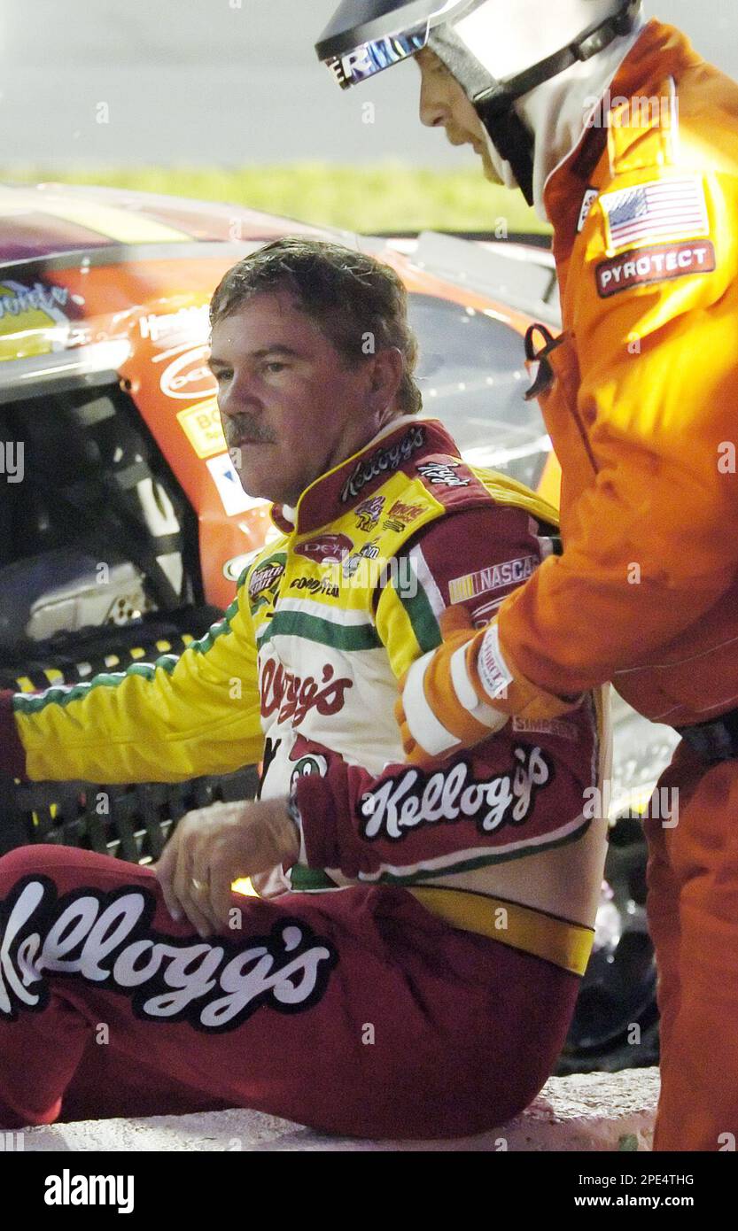 NASCAR driver Terry Labonte is helped from his car after a wreck in ...