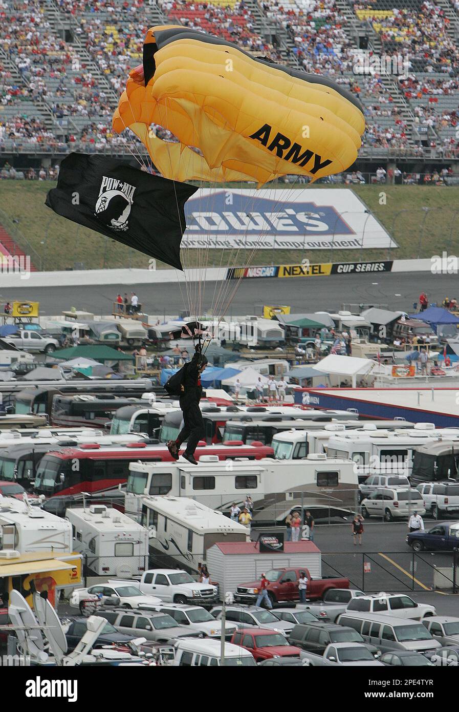 A member of the Army's Golden Knights parachute team arrives on the ...