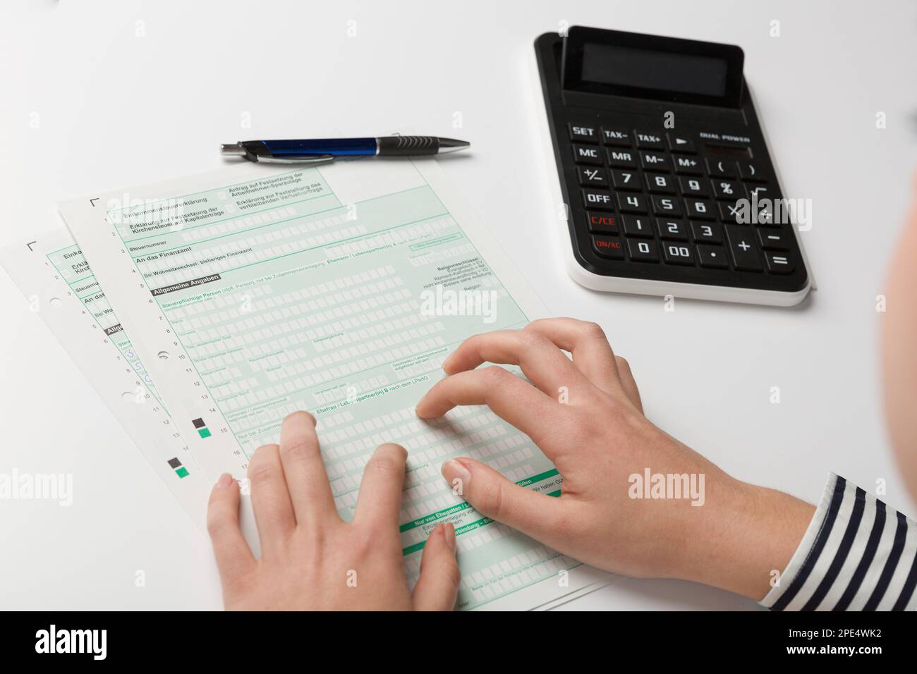 Completing income tax return forms hi-res stock photography and images ...