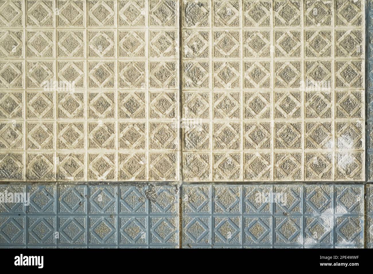 The texture of sand on the tile near the beach. View from above ...