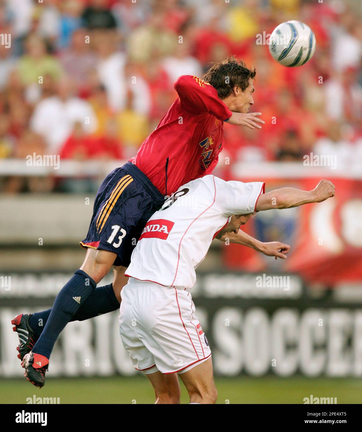Real Salt Lake defender Brian Dunseth (13) leaps over Chicago Fire ...