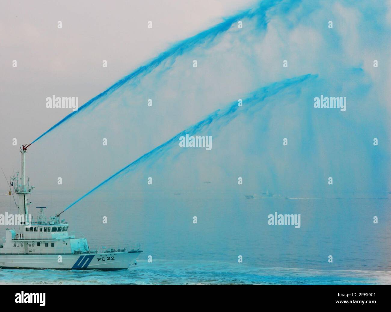 Patrol boat Hamagumo sprays blue-colored water as Japan Coast Guard ...