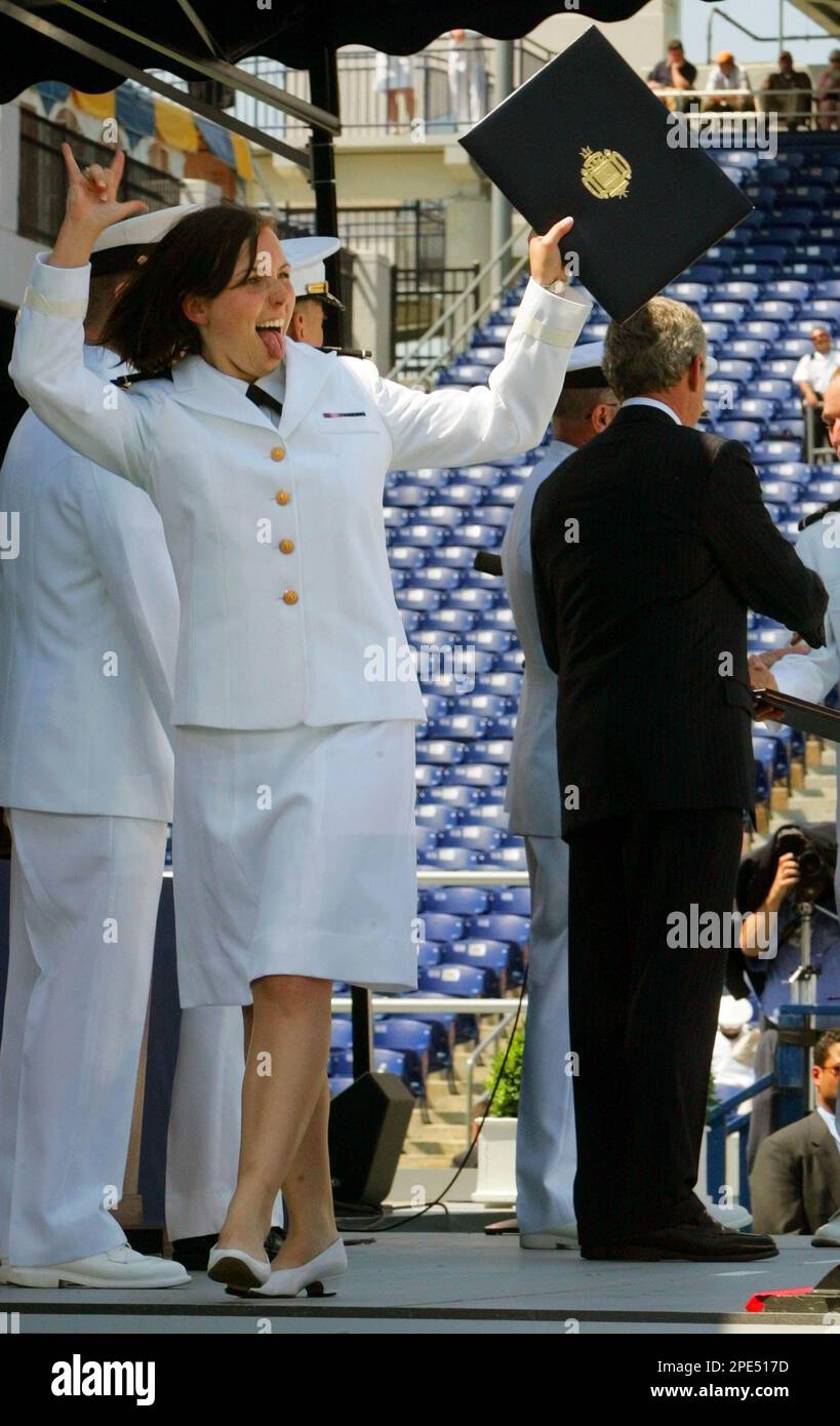 Victoria Leigh Tacconelli, left, reacts to receiving her diploma from ...