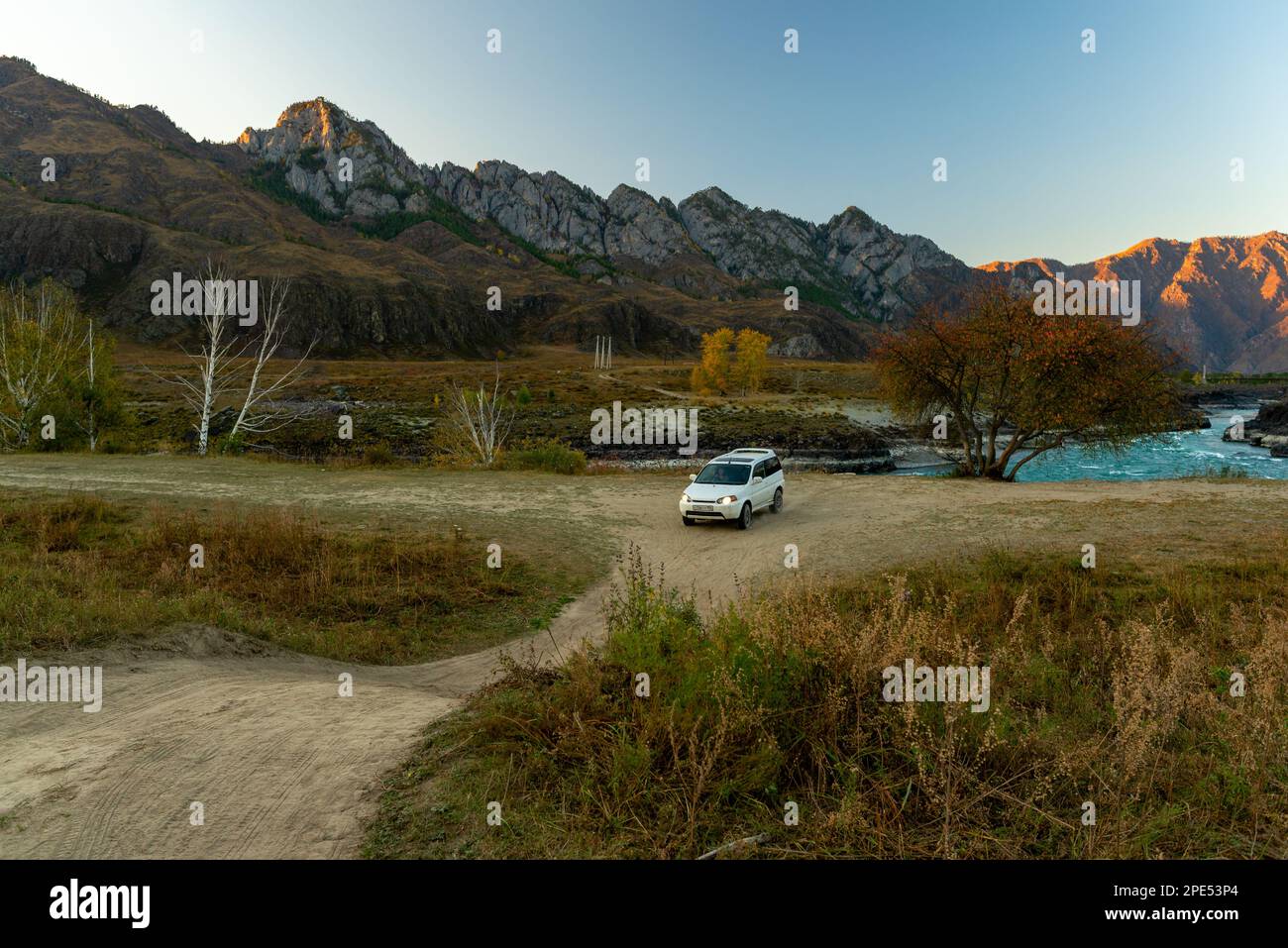 A Honda hr-v car is driving along a mountain road to an obstacle in the ...