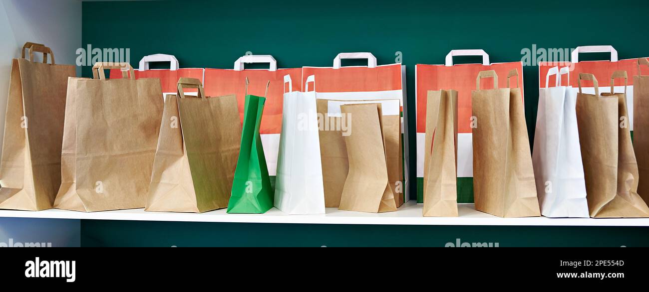 Paper bags on display in a store Stock Photo - Alamy