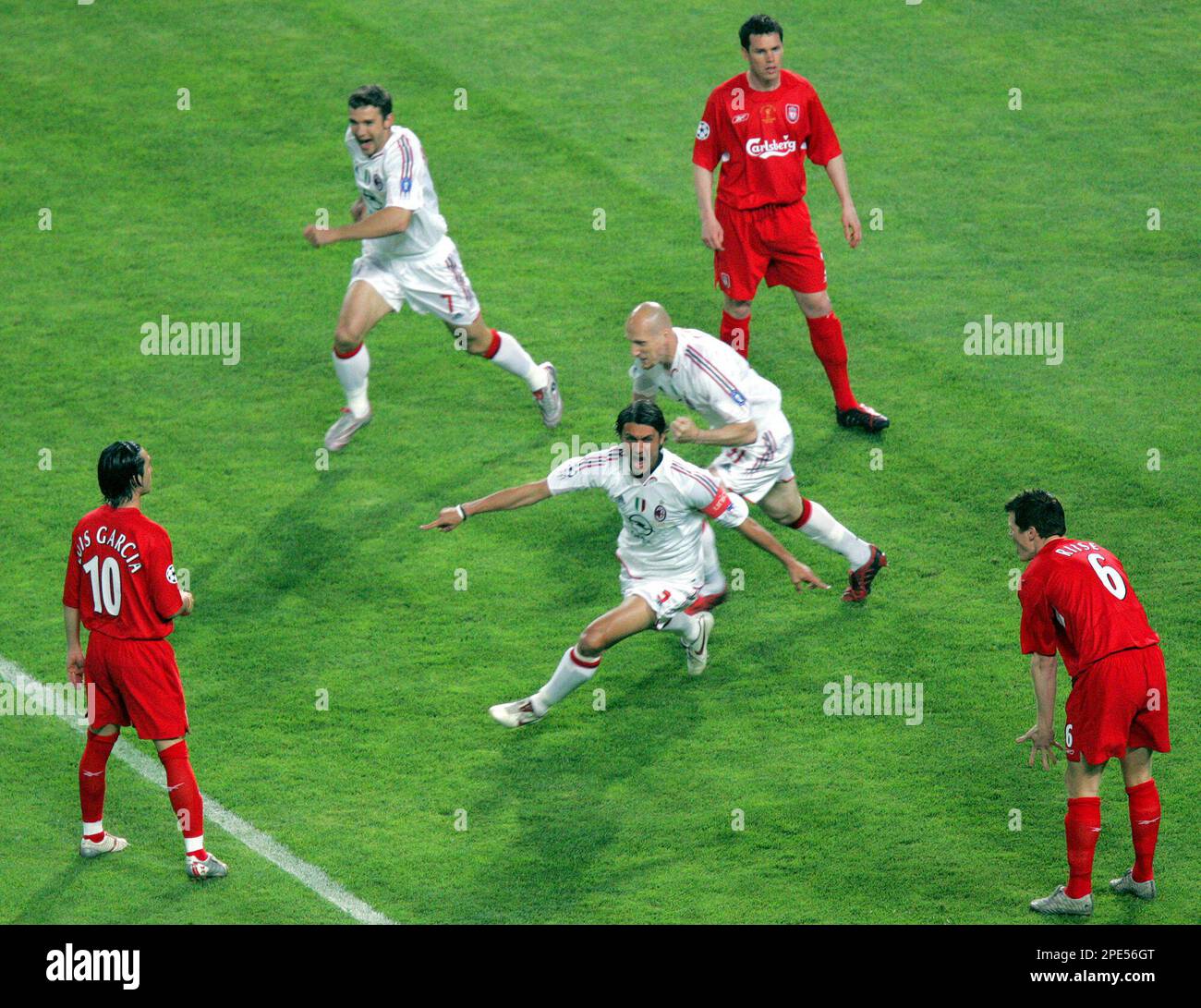 AC Milan's Paolo Maldini, center, celebrates after scoring the opening ...