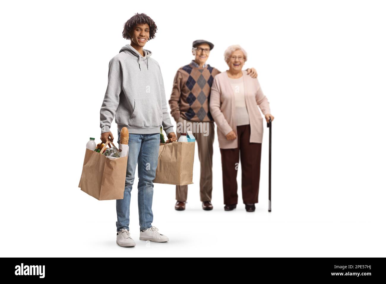 Young african american man helping an elderly man and woman and holding ...
