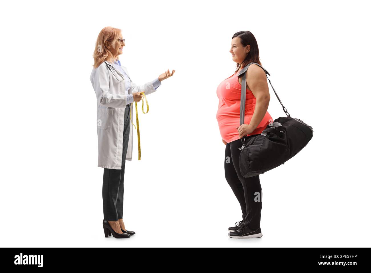 Full length profile shot of a doctor talking to to an overweight woman ...