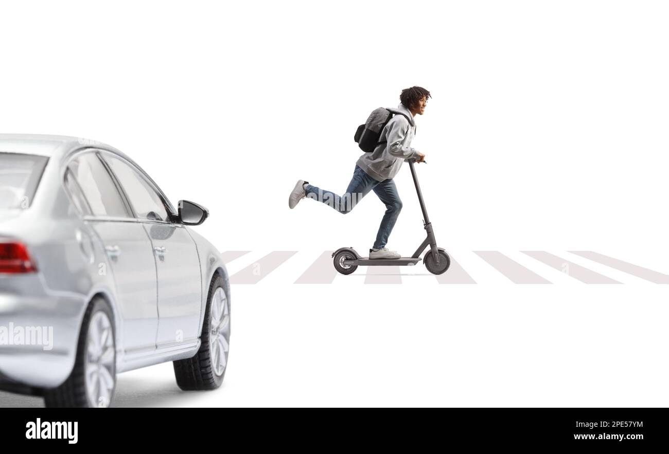 Car waiting and an african american male student riding an electirc ...