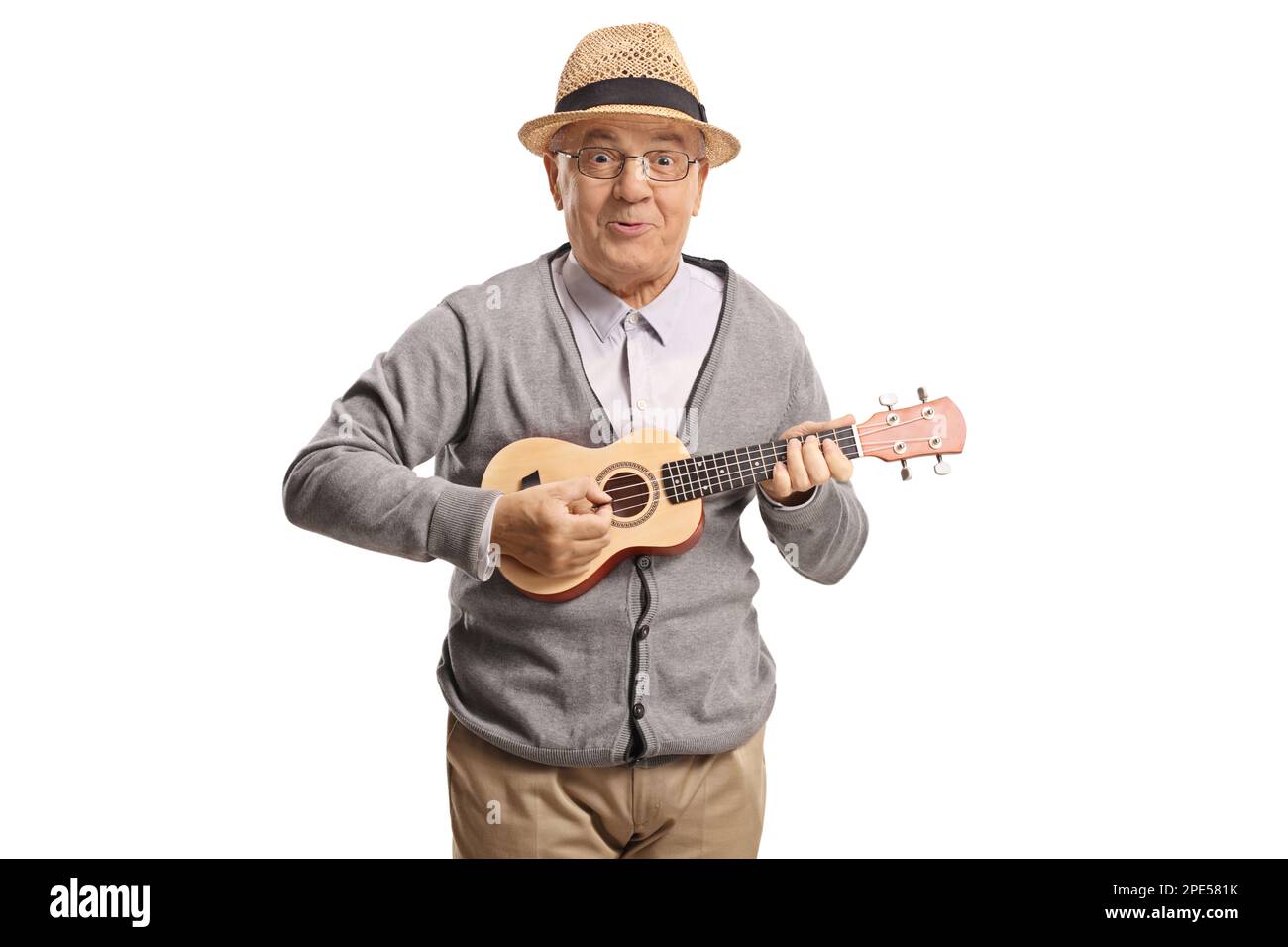 Funny senior man playing ukulele isolated on white background Stock ...