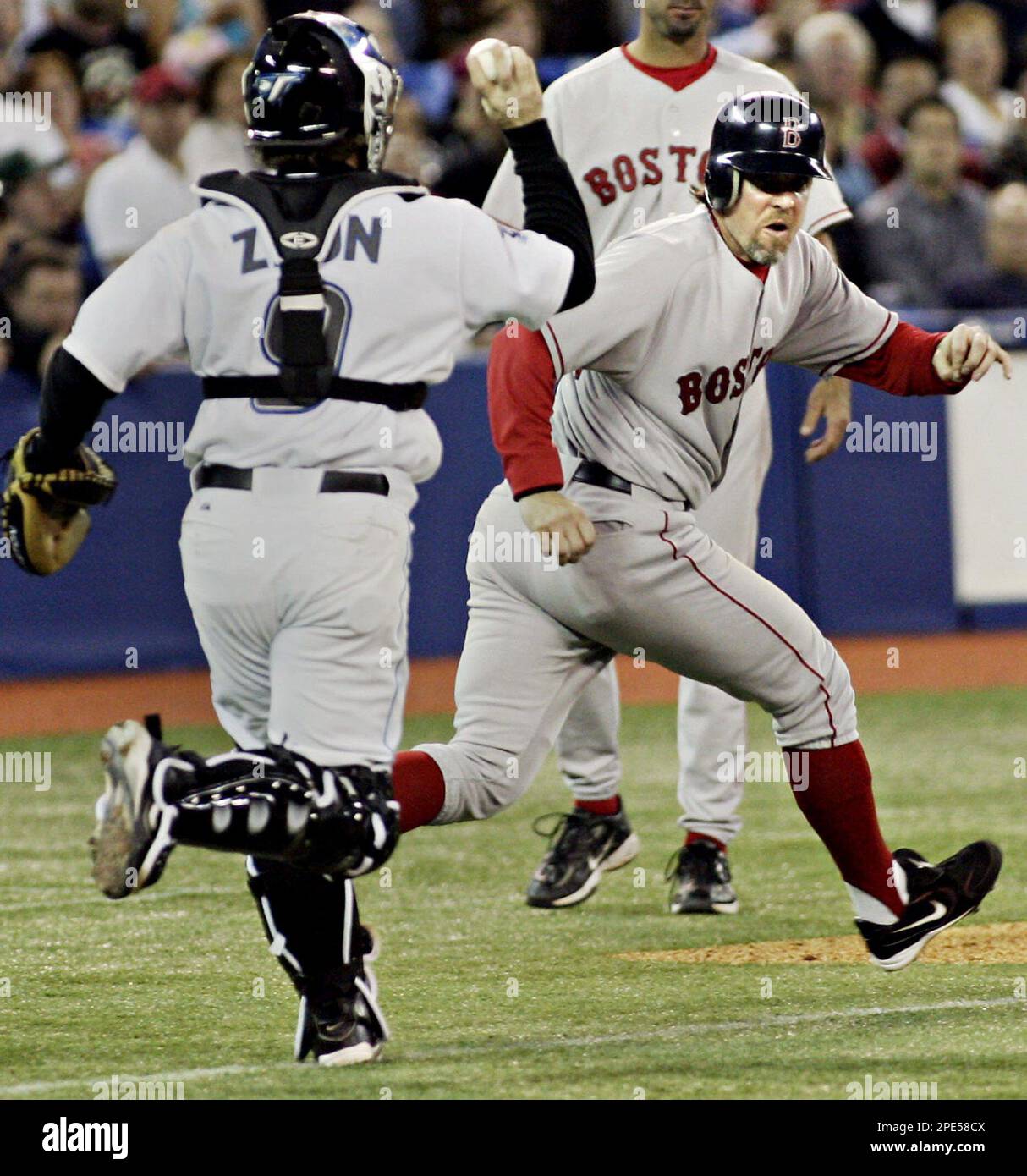 Boston Red Sox third baseman Bill Mueller (right) looks back at Toronto ...