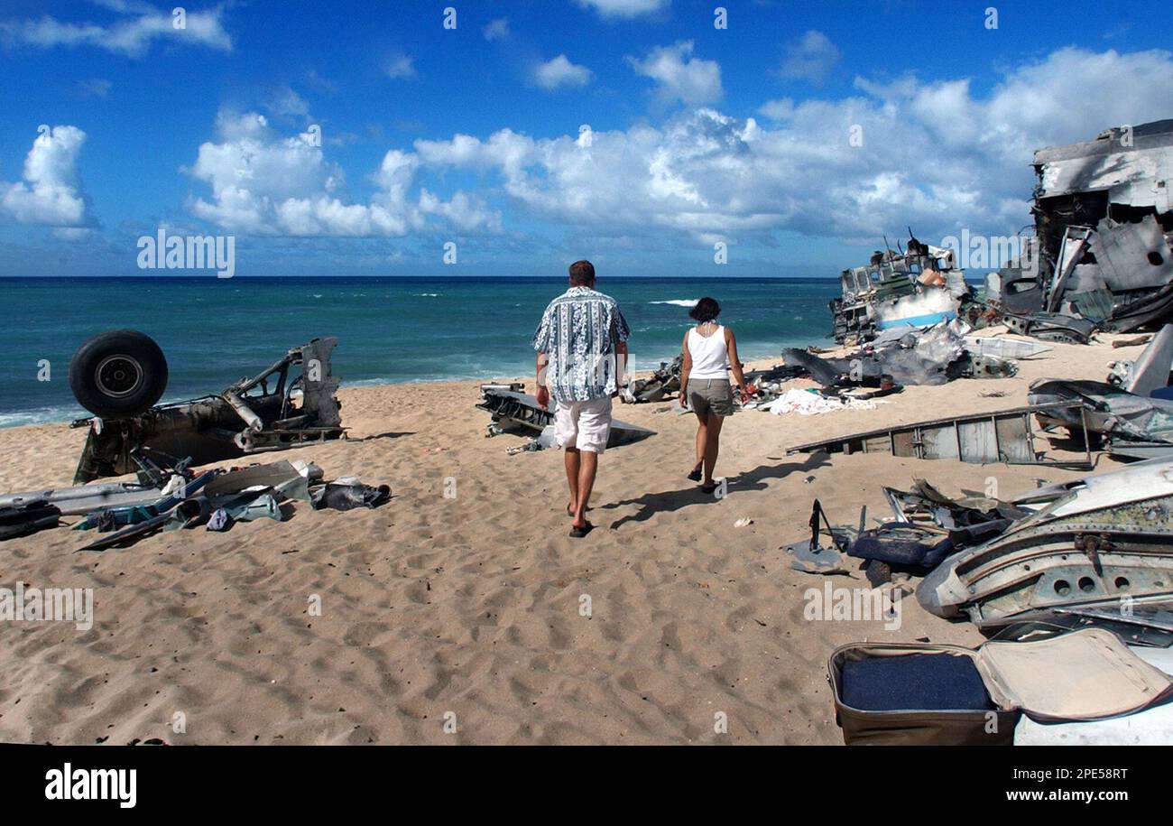 John and Charlotte Ray of Washington, D.C., walk thru the fake depris ...
