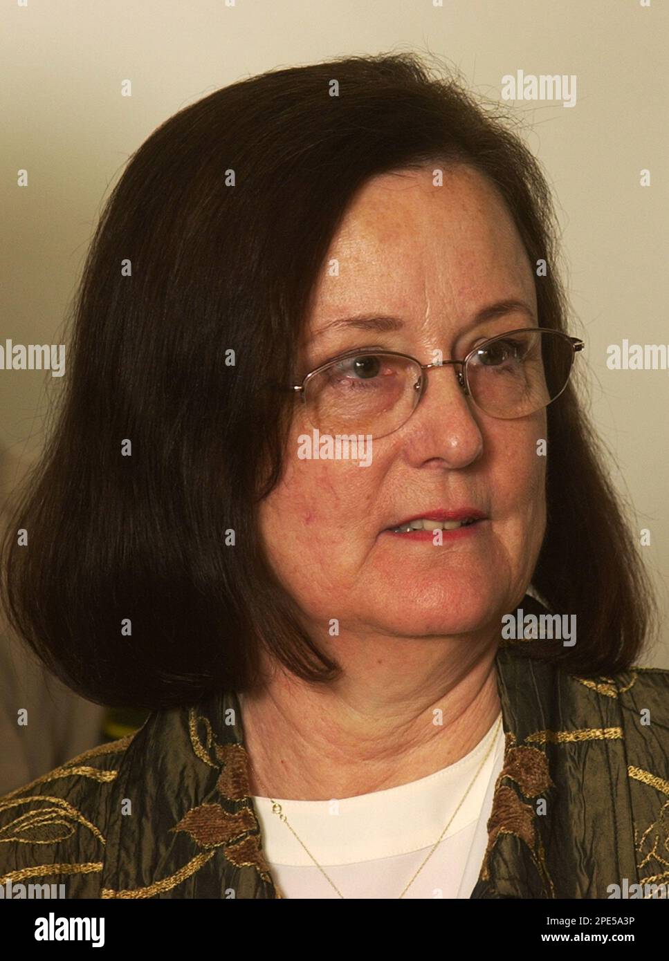 Defense witness Connie Keenan departs the courtroom following defense ...