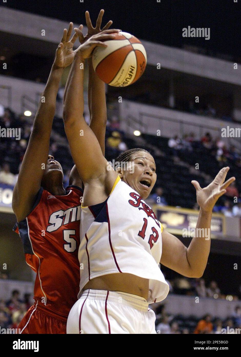 Indiana Fever's Natalie Williams, right, fights for a rebound with ...