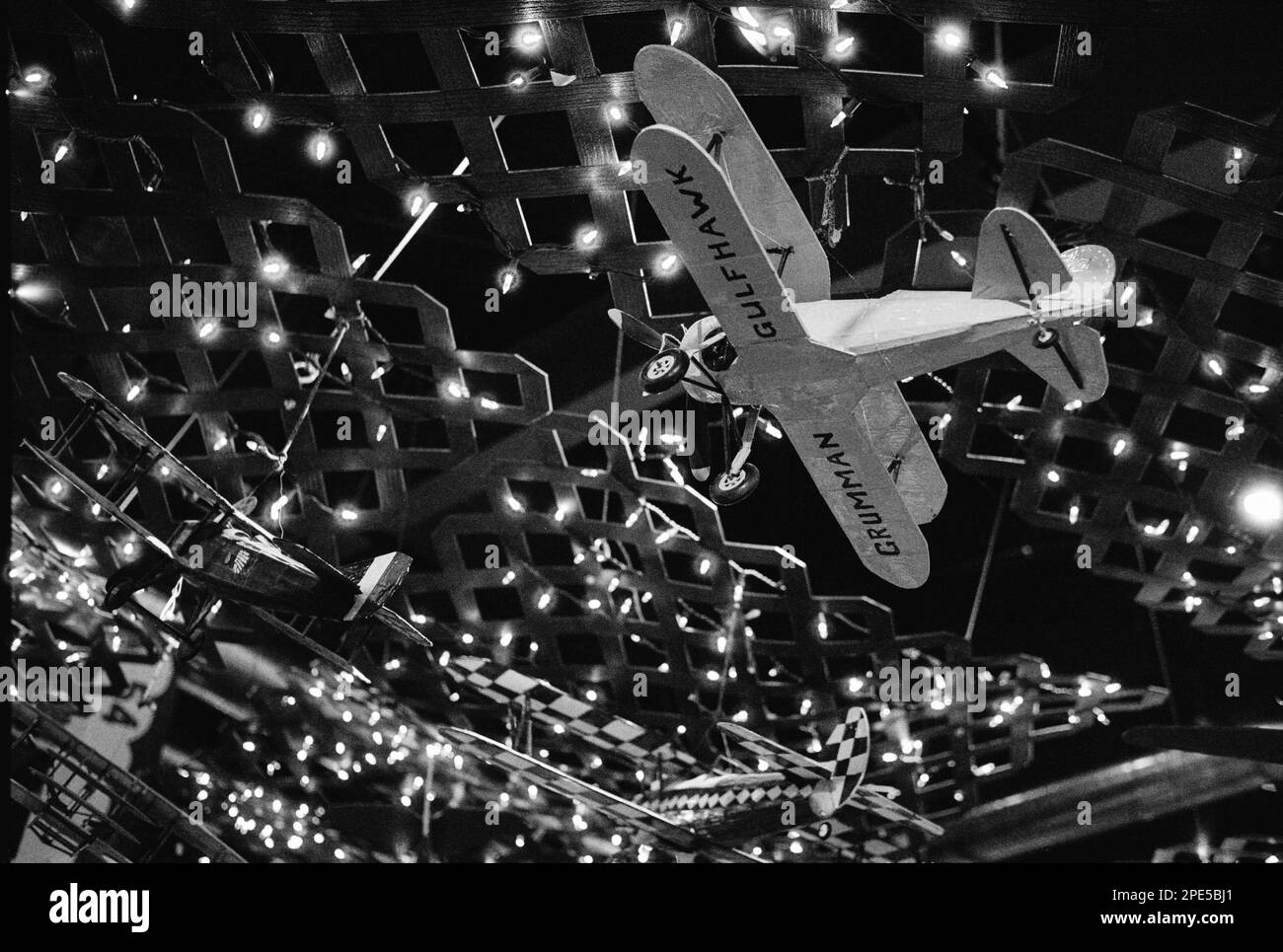 A paper and wood model of a Grumman Gulf Hawk biplane hangs from the ...