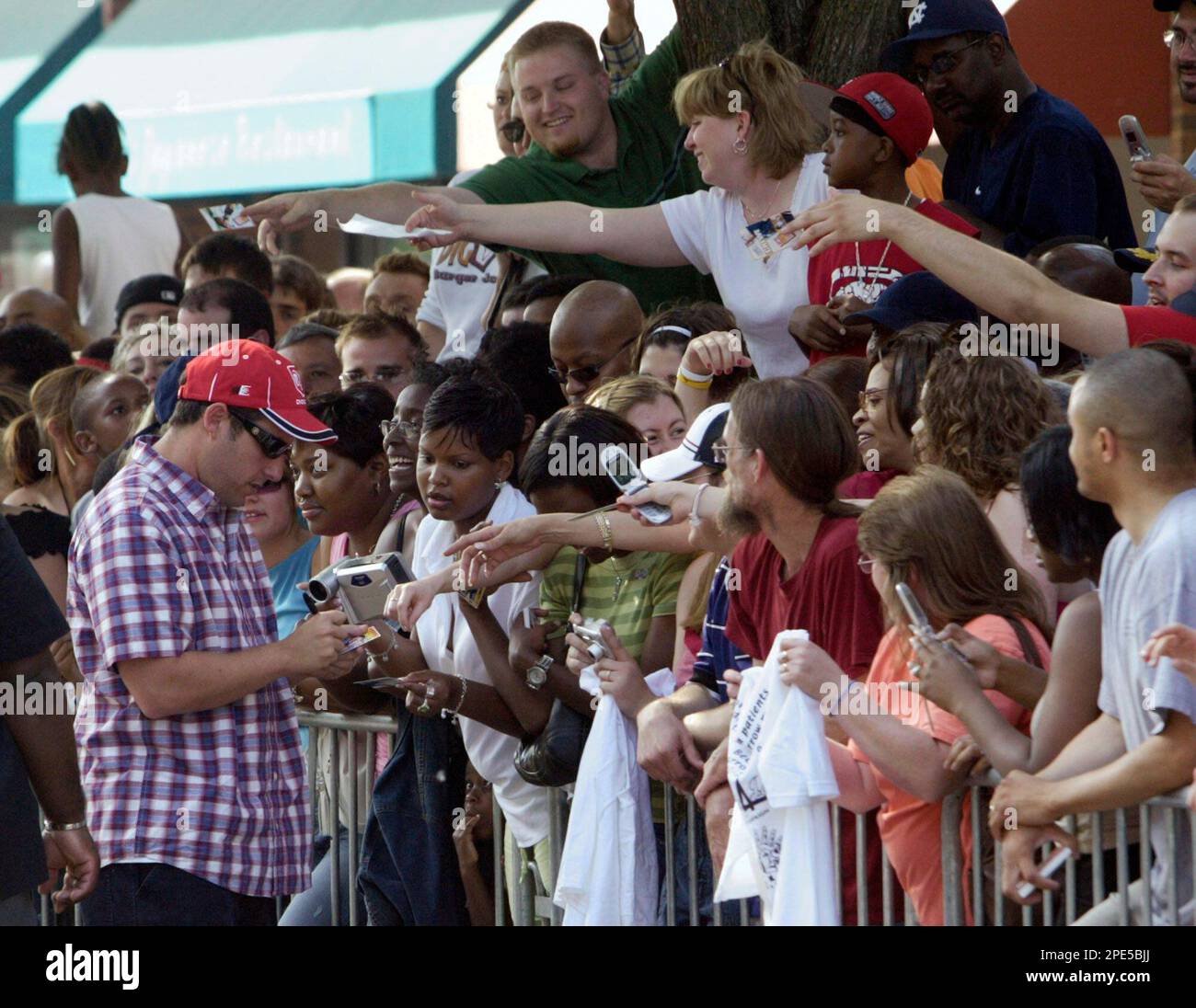 Adam Sandler signs autographs for fans at the charity screening of "The ...