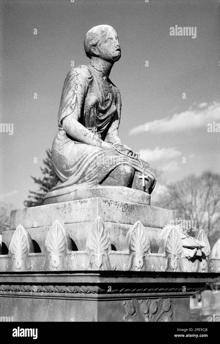 Sculpture grieving woman weathered historic Black and White Stock ...
