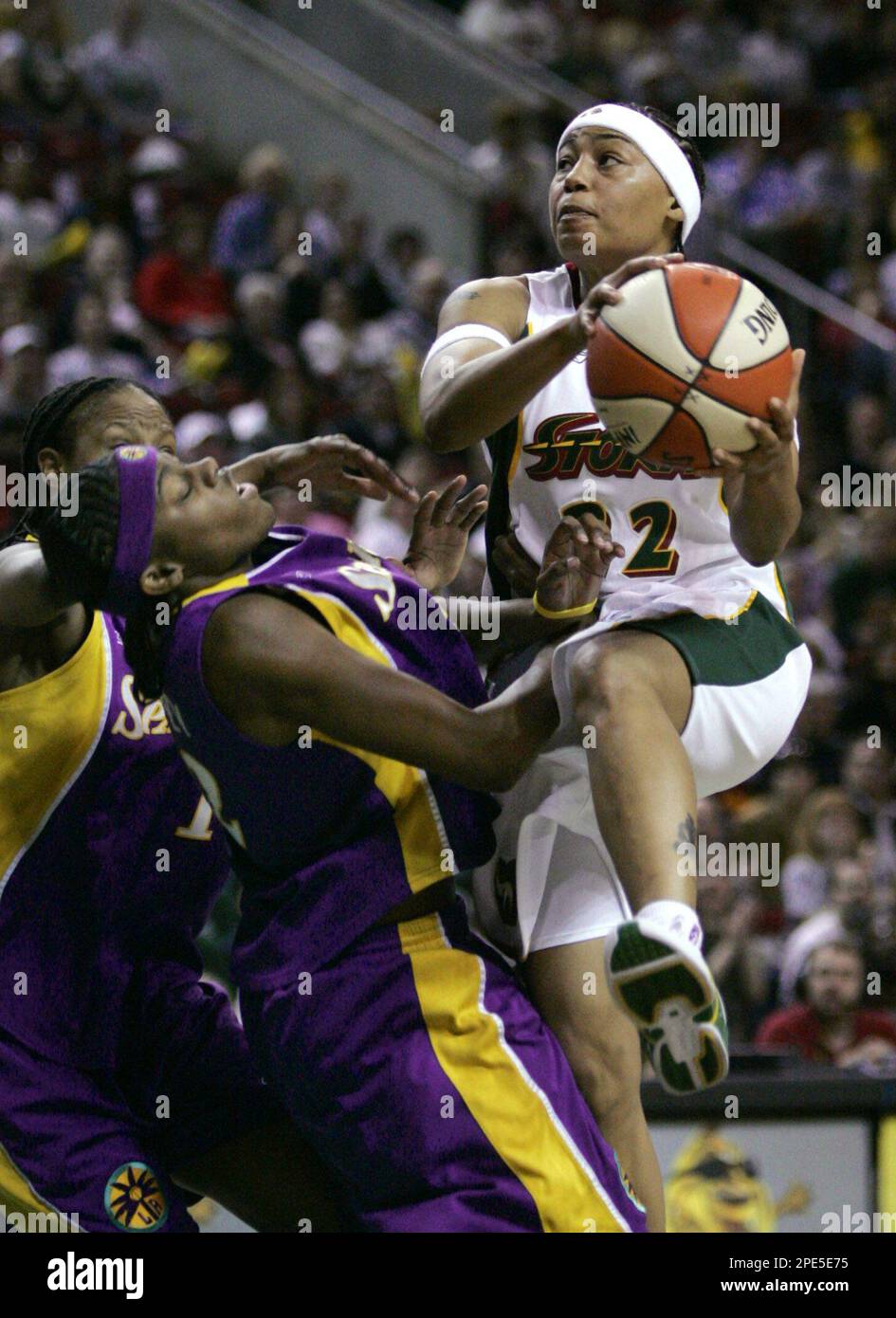 Seattle Storm's Betty Lennox, right, is fouled by Los Angeles Sparks ...