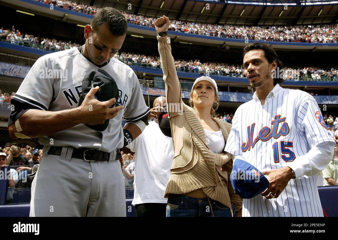 New York Yankees third baseman Alex Rodriquez, left, stands with ...