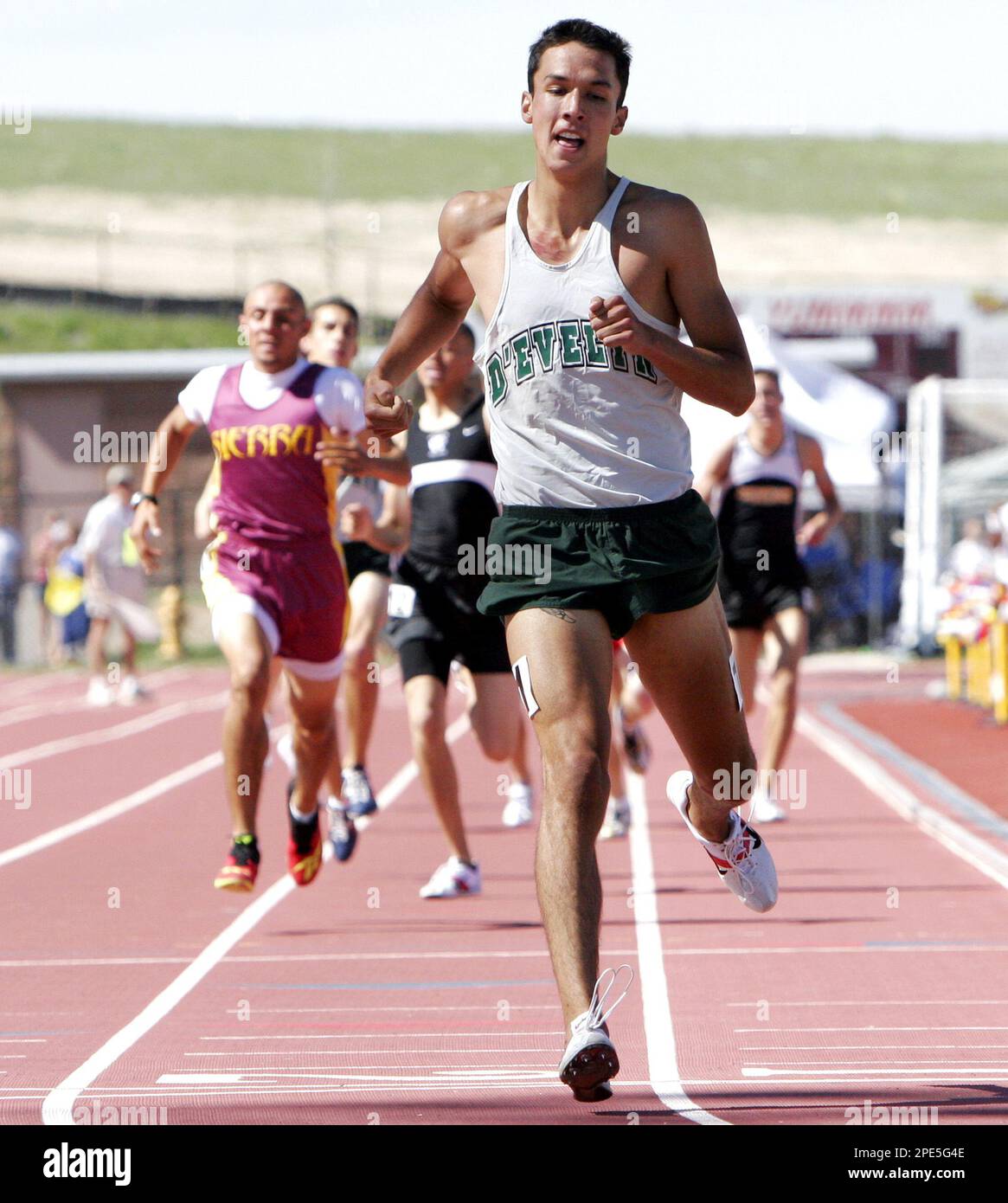 D'Evelyn's John McGuire crosses the finish line to win the Class 4A ...