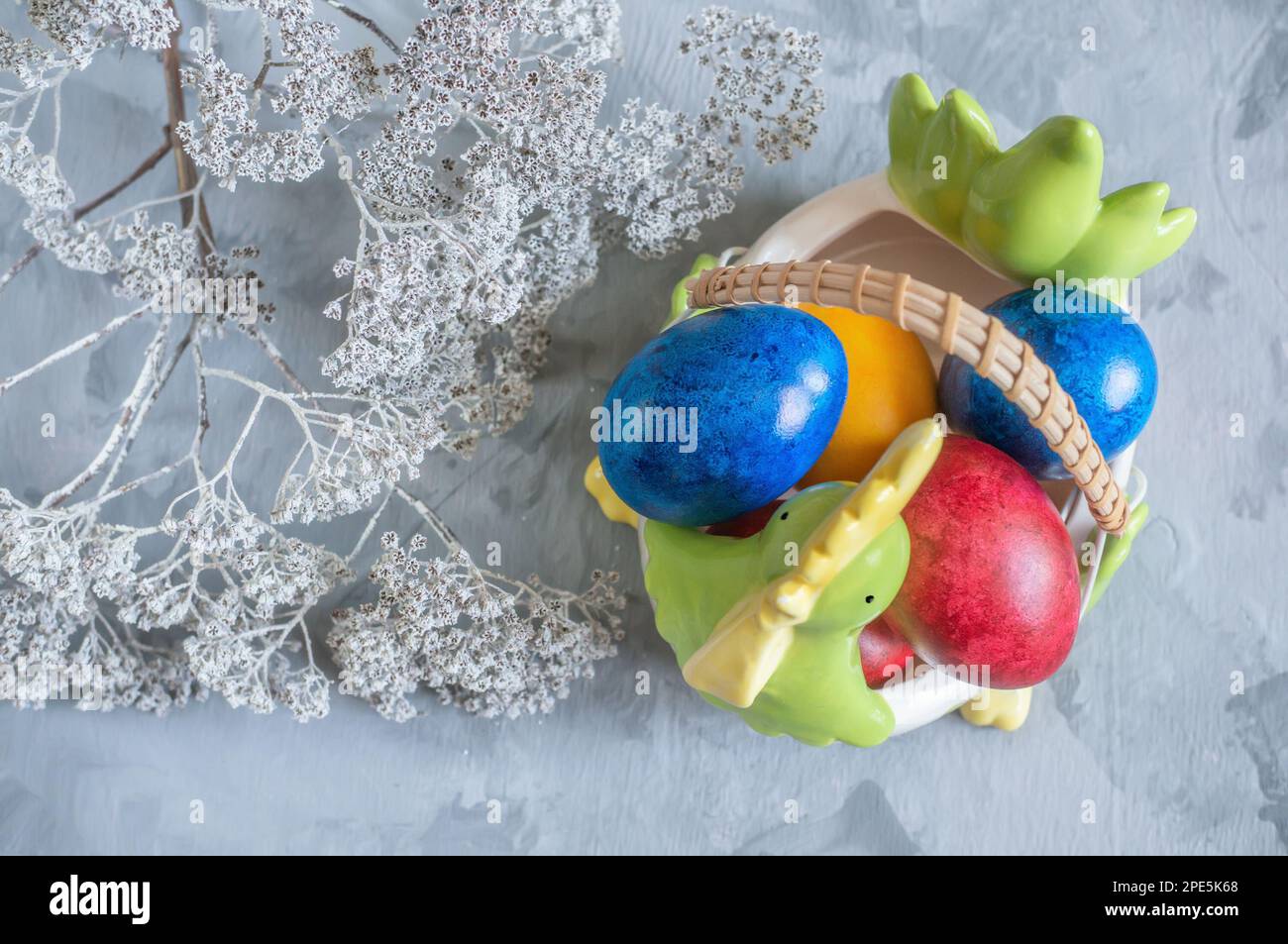 easter bright colored eggs in an Easter egg stand. Festive Easter ...