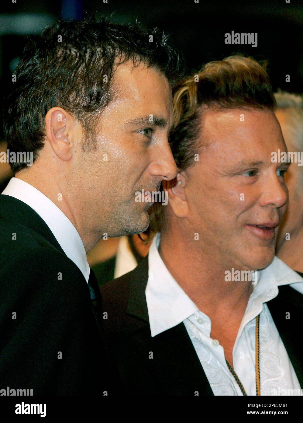 British actor Clive Owen, foreground, and American actor Mickey Rourke ...