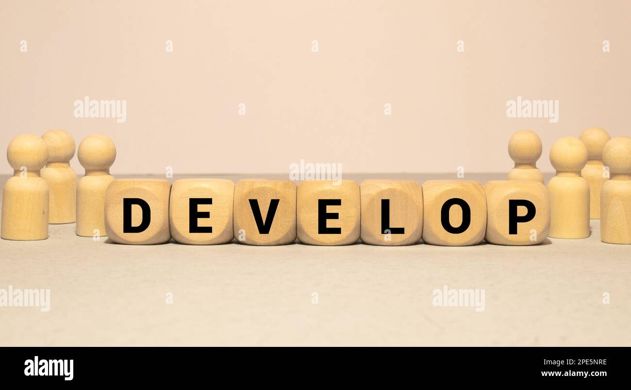 Develop word written on wood block. Develop text on cement table for ...