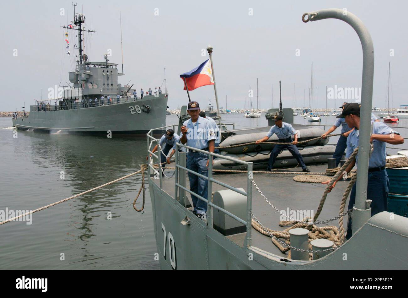 A newly-repaired Philippine Navy BRP Cebu (PS28), left, a patrol craft ...