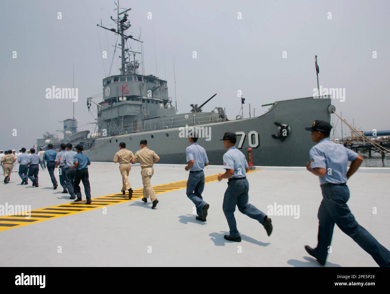 Philippine Navy sailors rush to the newly-repaired BRP Quezon (PS70), a ...