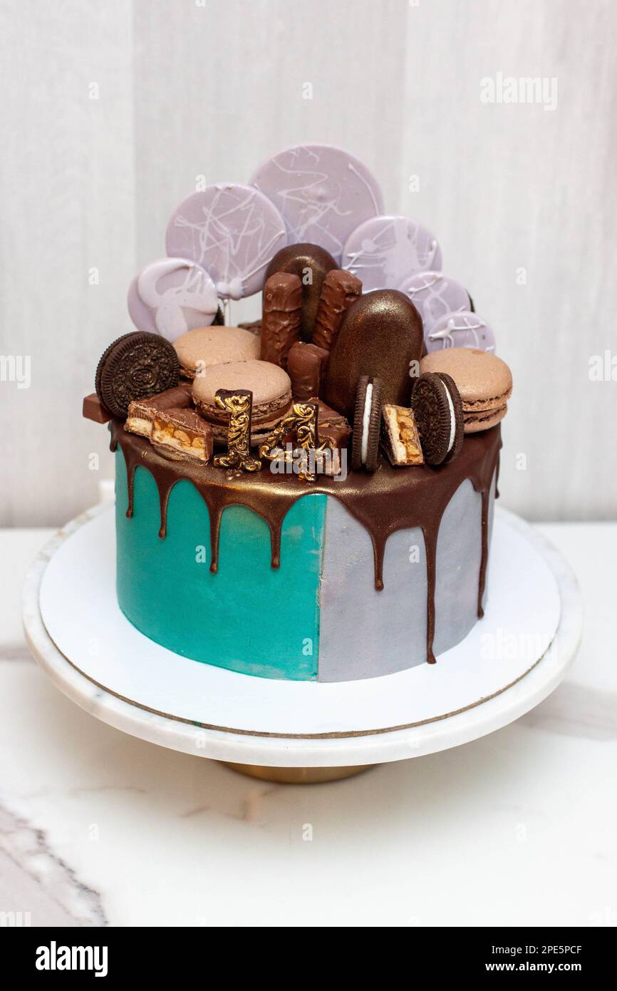 Delicious two-sided homemade birthday cake made in green and grey ...