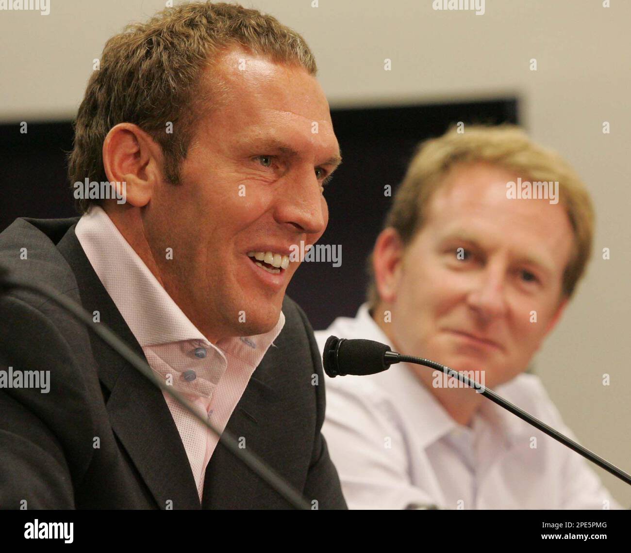 Phoenix Suns general manager Bryan Colangelo, left, speaks after ...