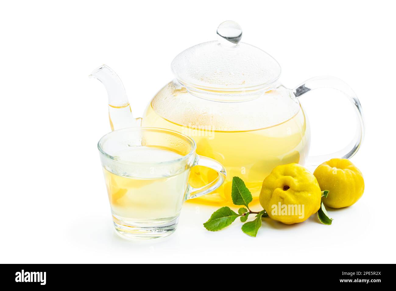 Hot quince tea in transparent teapot with fresh fruits isolated on ...