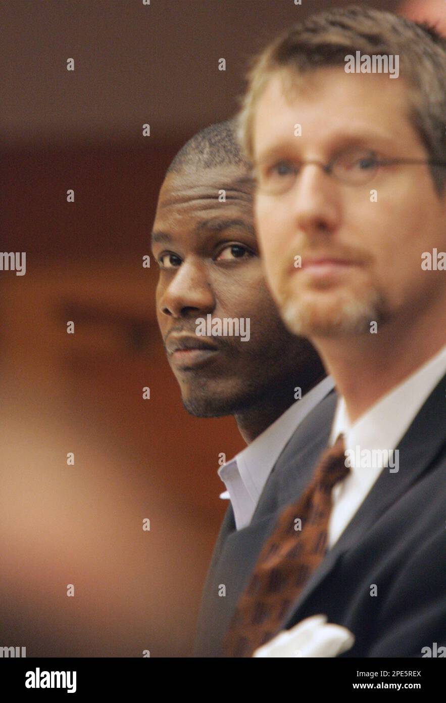Brian Nichols, left, stands behind his attorney Christopher Adams ...