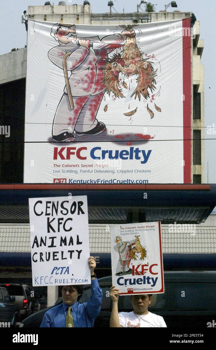 Members of the People for the Ethical Treatment of Animals hold slogans ...