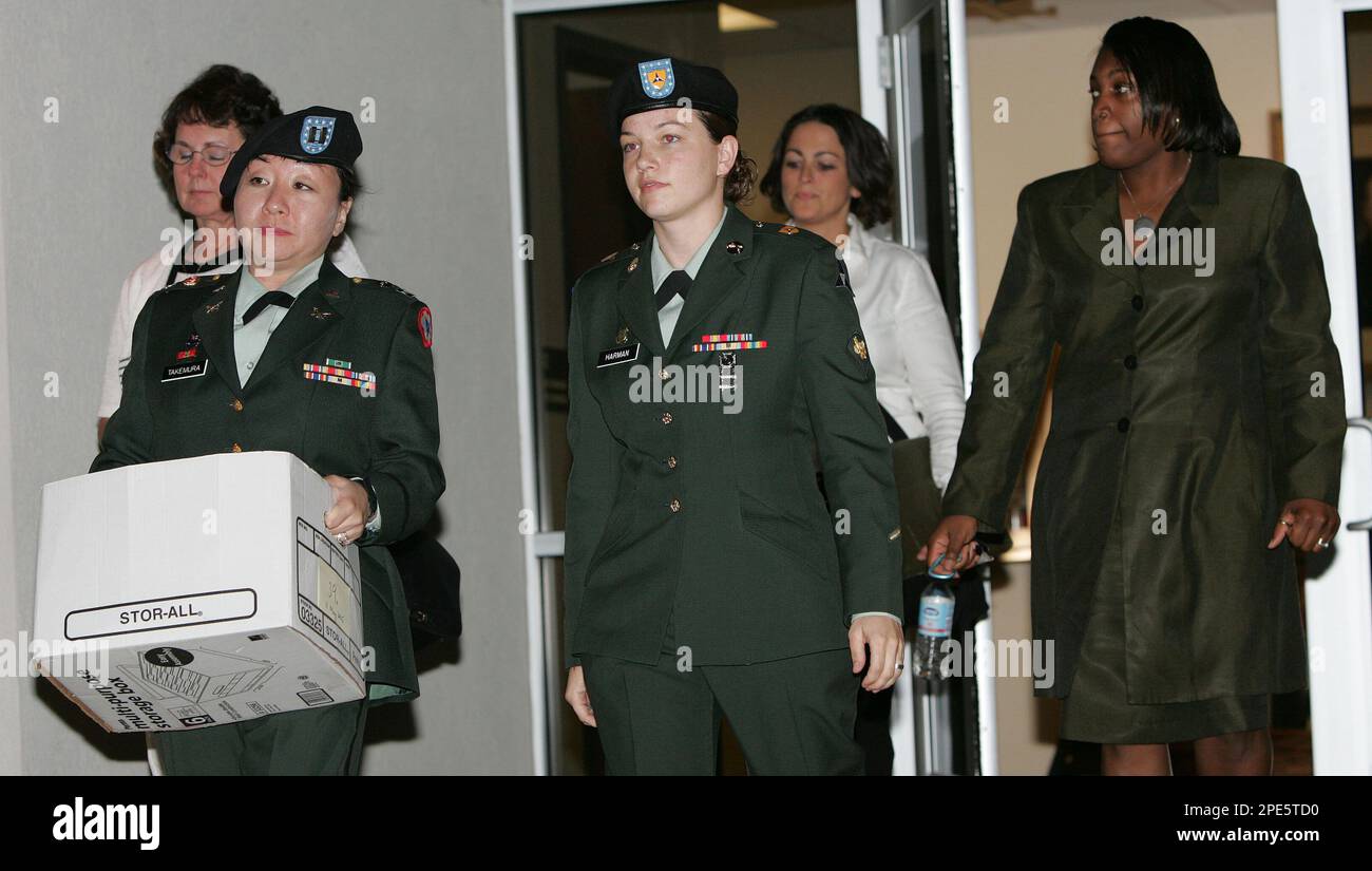 U.S. Army Spc. Sabrina Harman, center, leaves the courthouse with her ...
