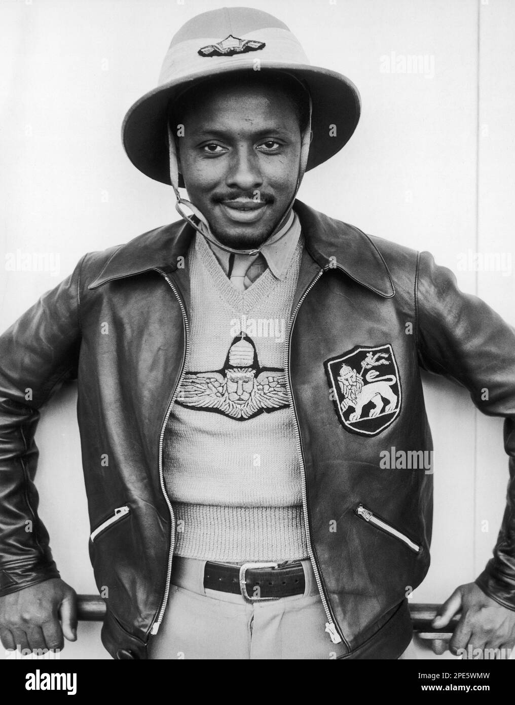 Sporting a pair of Ethiopian-spun gold wings across his tan sweater ...