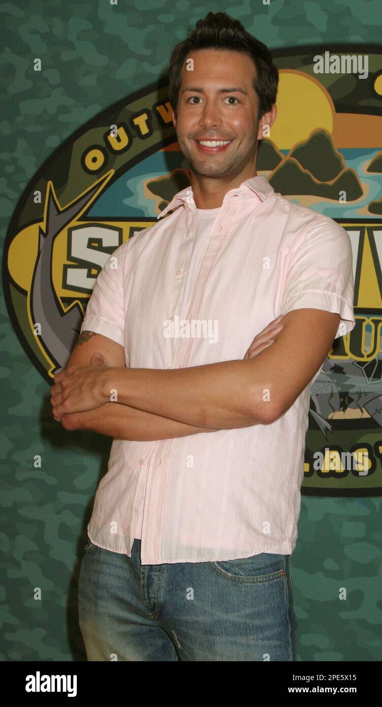 Coby Archa poses for photographers as he arrives for the finale and ...