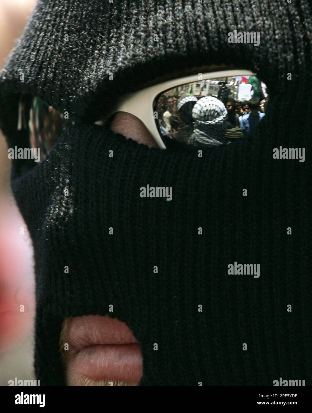 A masked Palestinian militant from the al-Aqsa Martyrs Brigades attends ...