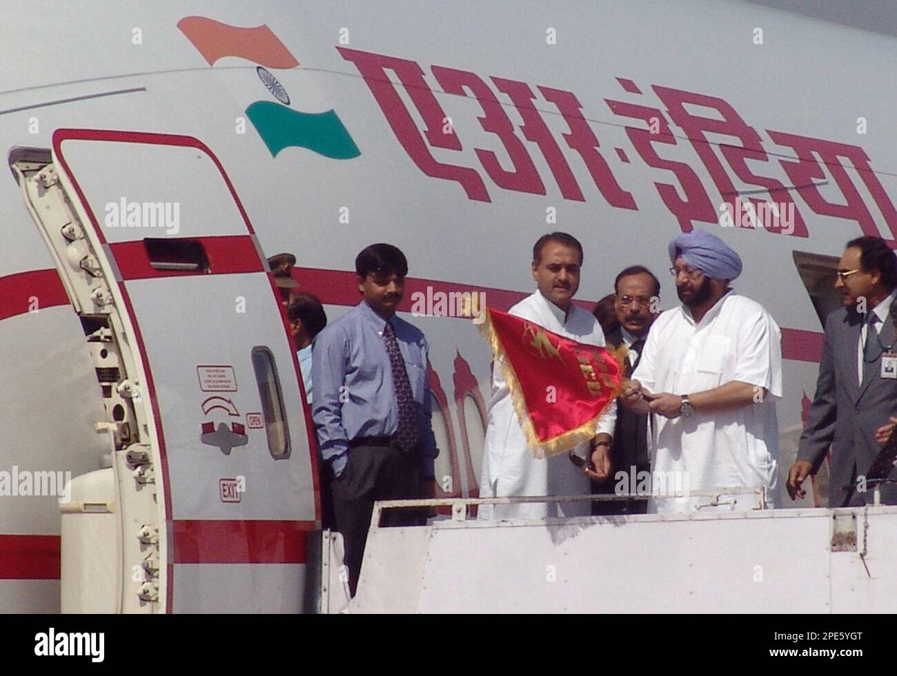 Punjab Chief Minister Amrinder Singh, second right, and Indian aviation ...