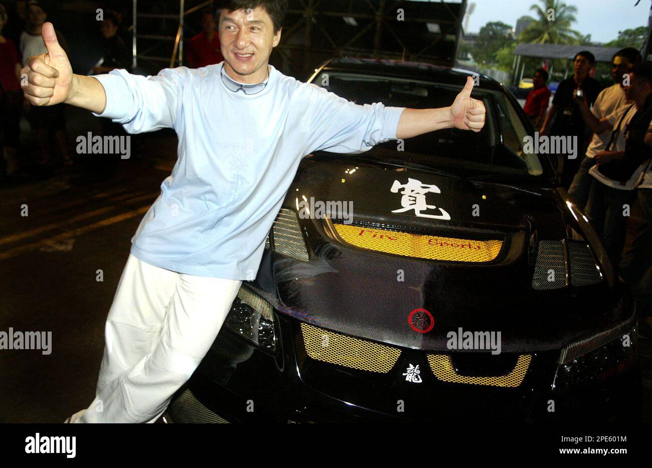Action hero Jackie Chan poses in front of the Jackie Chan limited ...