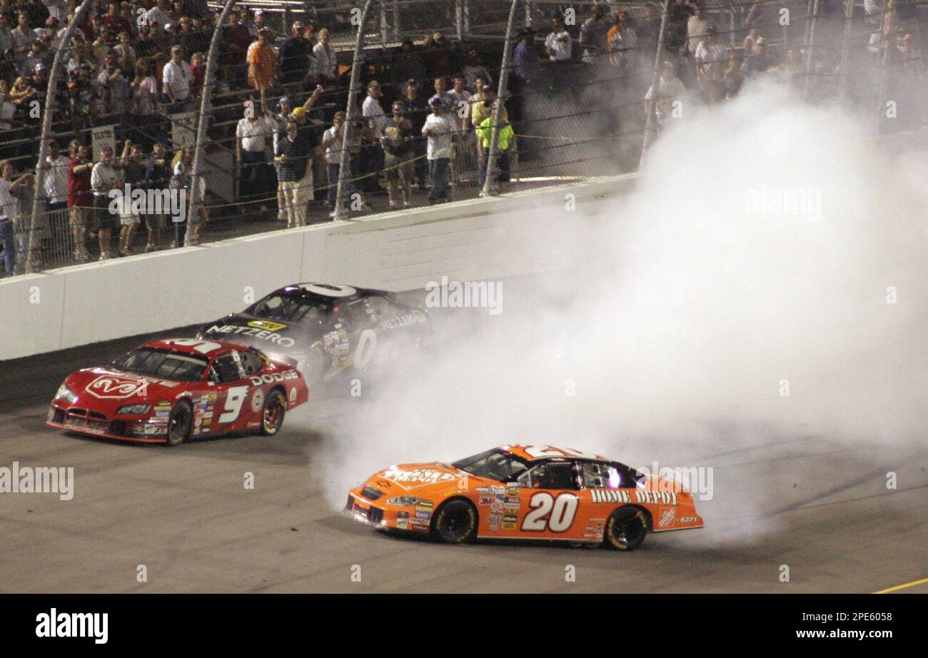Tony Stewart (20) spins out as Kasey Kahne (9) and Mike Bliss (0) pass ...