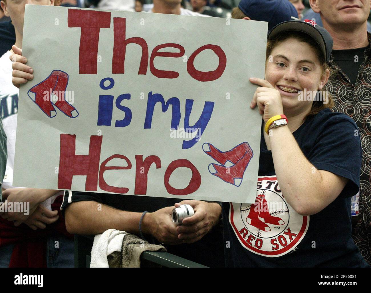 Raezel Geiser, of Seattle, holds a sign trying to attract the attention ...