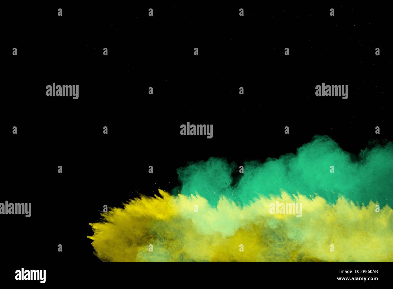 Yellow and green dust explosion on black background. Abstract yellow ...