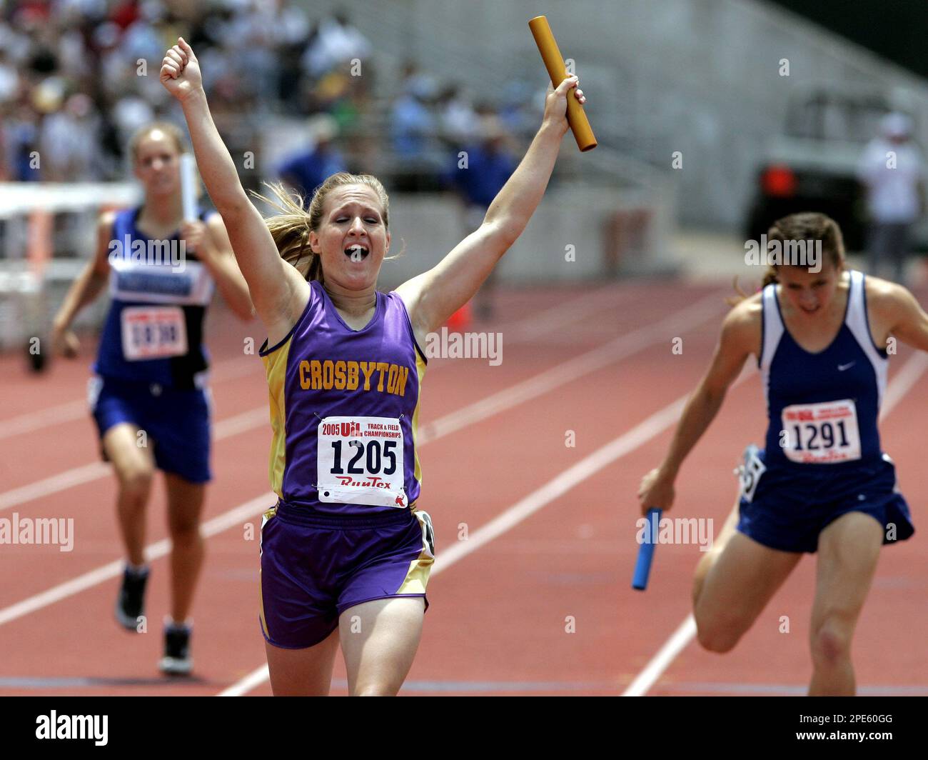 Crosbyton's Amanda Alley (1205) raises her arms as she crosses the ...