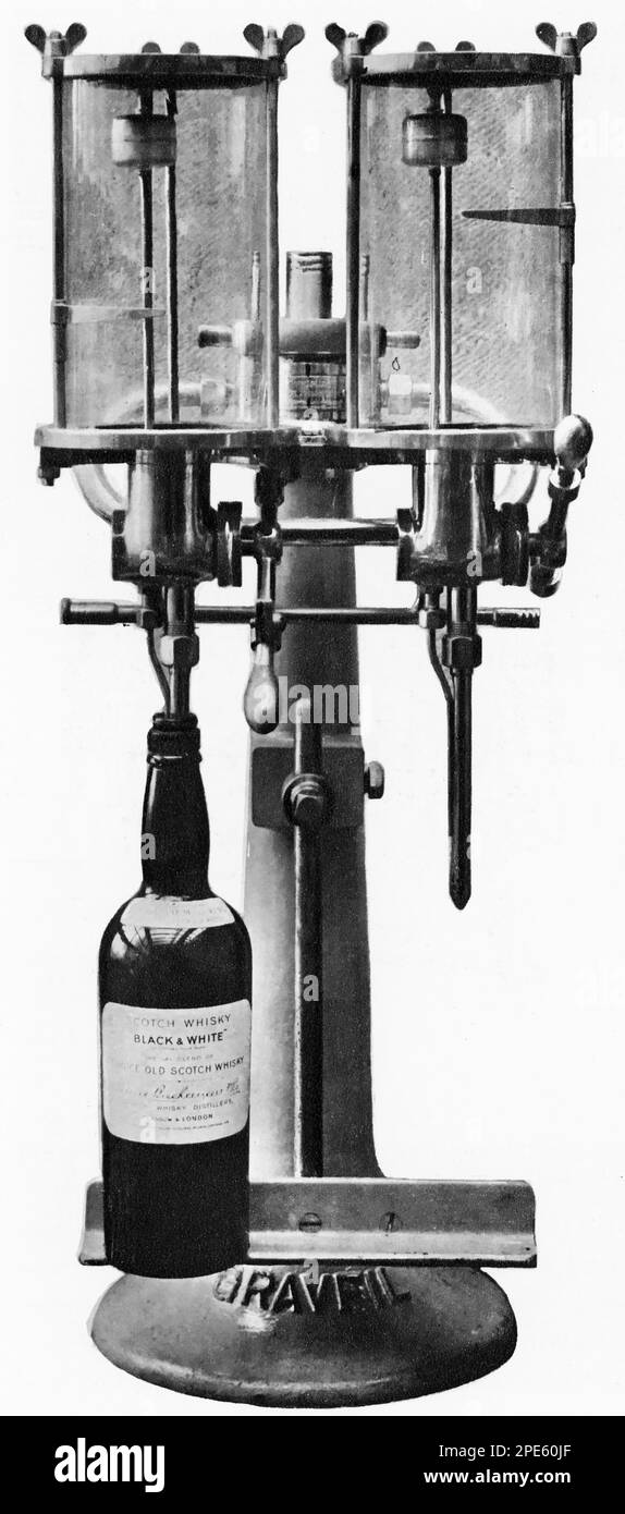 Two head gravity filling machine hi-res stock photography and images ...